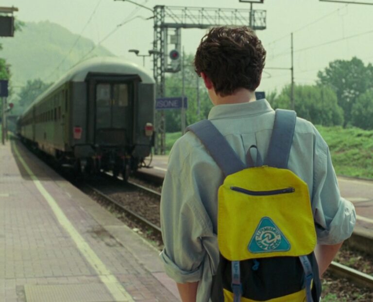 YELLOW BACKPACK worn by Elio Perl­man (Tim­o­th­ée Cha­la­met) as seen ...